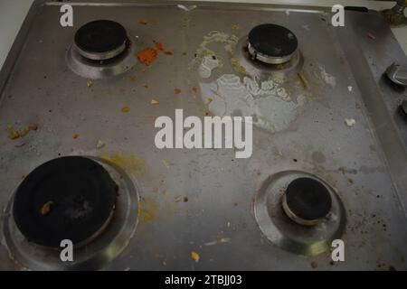 non edited photo of Dirty stove in the kitchen with food leftovers ...