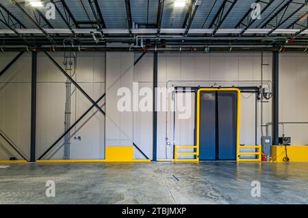 Loading Dock Doors in Cold Distribution Warehouse Stock Photo - Alamy