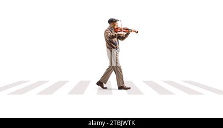 Elderly man crossing a street and playing a violin isolated on white ...