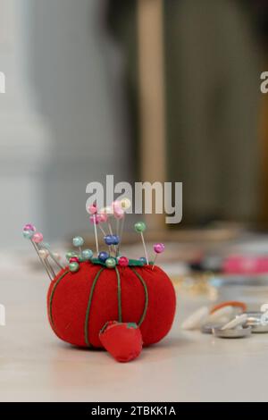 Close up of multi colored pins in red pin chushion Stock Photo - Alamy