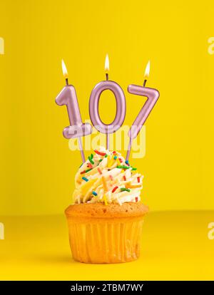 Birthday candle number 107 - Invitation card in orange background Stock ...