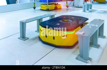 warehouse robot car carries cardboard box assembly in factory Stock Photo - Alamy