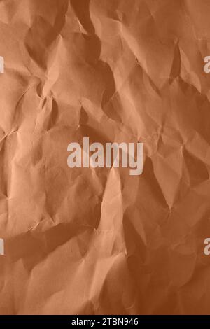 Crumpled paper Peach Fuzz color of the year 2024. Texture crumpled ...