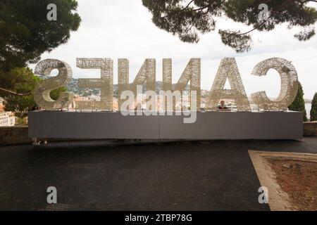 Large letters spell the word Cannes, sign overlooking town from Place ...