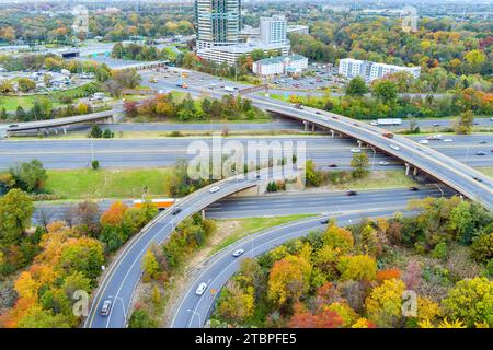 American freeway intersection with fast driving cars and trucks. View ...