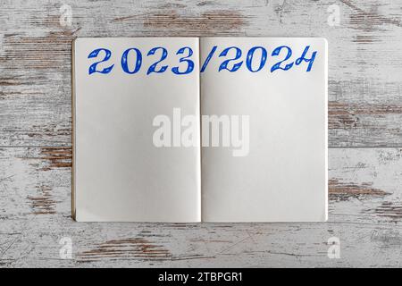 Notepad with dates 2023 and 2024 Stock Photo - Alamy