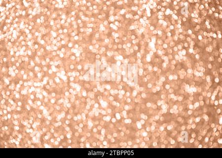 Peach fuzz sparkling glitter bokeh background, abstract defocused ...