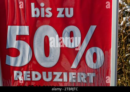Advertising poster indicates price reductions of up to 20 Stock Photo ...