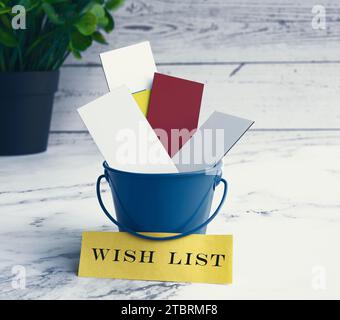 Colorful paper inside of a blue bucket with copy space. Bucket list ...