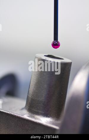 Close Up of Pink Probe CMM Inspection of Industrial Part in Light ...