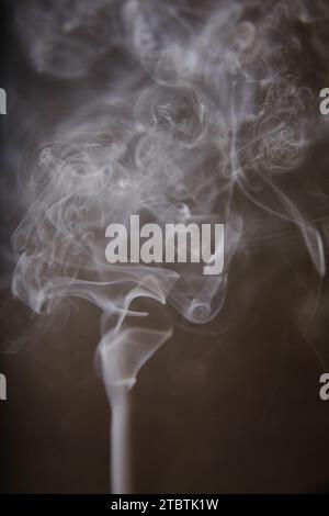 Ethereal Dance of Incense Smoke against Dark Background Stock Photo - Alamy