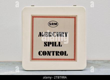 Closed Mercury spill control kit box standing upright on a shelf with ...