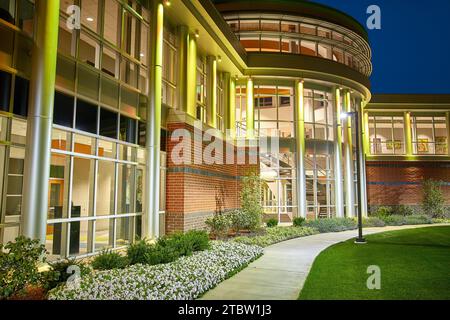 Modern white curved architectural building with glass balconies in ...