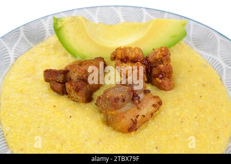 Cuban cuisine, corn meal with fried pork and avocado Stock Photo - Alamy