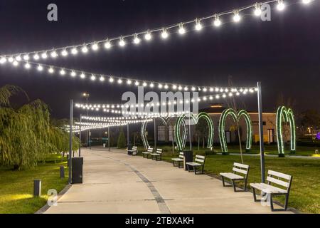 Evening festive path decorated with bright lanterns Stock Photo - Alamy