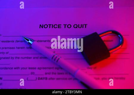 Notice to quit blank form with pen and small padlock on office table ...