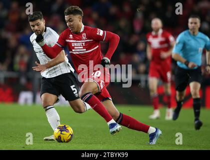 Middlesbrough's Morgan Rogers (right) chased by Ipswich Town's Sam ...