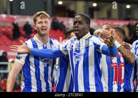 Djeidi Gassama #41 of Sheffield Wednesday goes past Ilias Chair #10 of ...