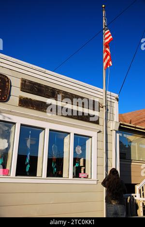 The young worker in the postal office dealing with parcels Stock Photo ...