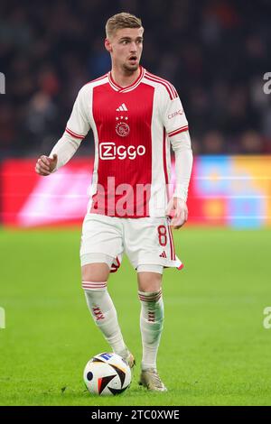 AMSTERDAM - (l-r) Ajax player Kenneth Taylor in duel with NEC player ...