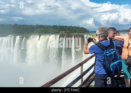 Tourists watching Devil's Throat from the Brazilian side of Iguazu ...