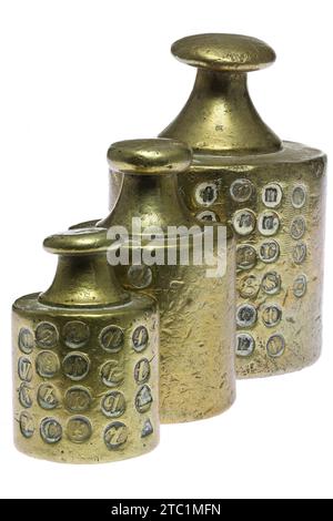 vintage brass weights with several calibration hallmarks isolated on ...