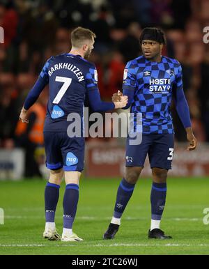 Derby County's Tom Barkhuizen (left) and Leeds United's Manor Solomon ...