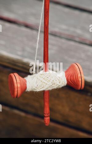 The vintage wooden spindle is a valuable tool for hand spinning and ...