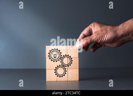 Wooden blocks with symbol of automation concept Stock Photo - Alamy
