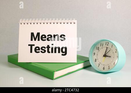 means testing, text on white notepad paper on gray background Stock ...