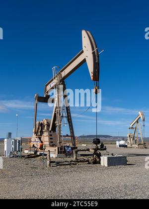 Working oil pump with blue sky Stock Photo - Alamy
