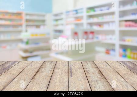 wood counter product display with Pharmacy store interior blurred ...