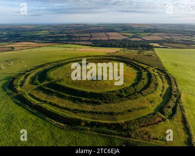 Aerial view of Castle an Dinas, a Cornish Iron Age Hillfort, at sunrise ...