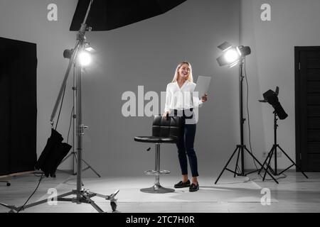 Casting call. Emotional woman performing against grey background in ...