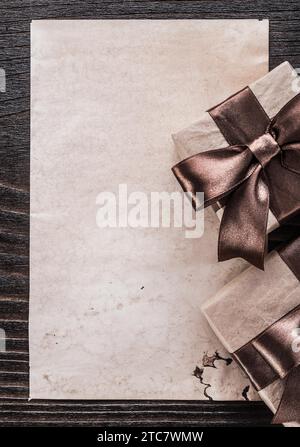 Present boxes tied bow sheet of wrapping paper celebration concept ...