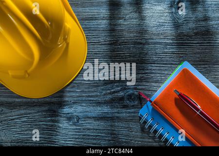 Vintage building helmet notebook pen on wooden board Stock Photo - Alamy