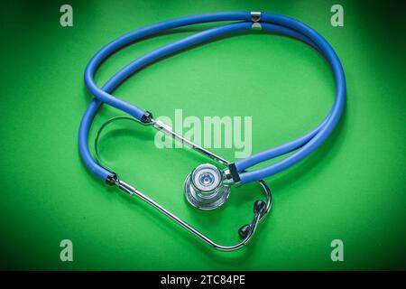 Medical stethoscope on green background top view Stock Photo - Alamy