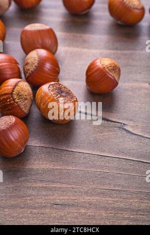 hazelnuts on vintage wooden board food and drink concept Stock Photo ...
