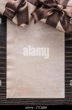 Present boxes with tied ribbons paper vertical view holiday concept ...