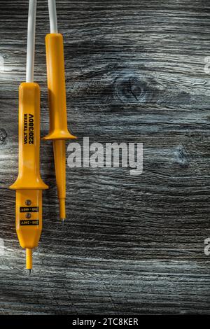 Electric tester on wooden board Stock Photo - Alamy