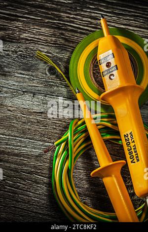 Electric tester hunk of rolled cable insulation tape on vintage wooden ...