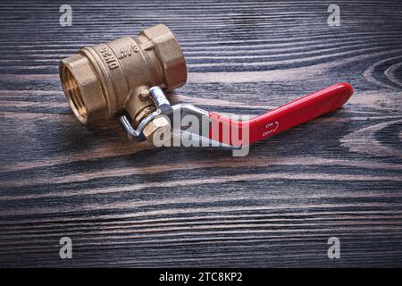 Full bore lever ball valve on wooden background plumbing concept Stock ...