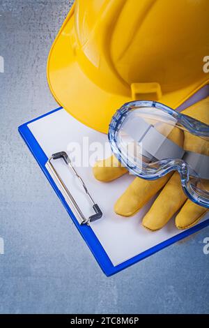 Plastic glasses protective gloves notepad pen on metallic background ...