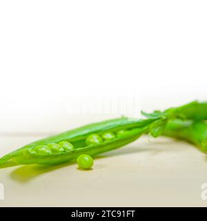 hearthy fresh green peas over a rustic wood table Stock Photo - Alamy