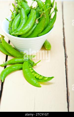 hearthy fresh green peas over a rustic wood table Stock Photo - Alamy