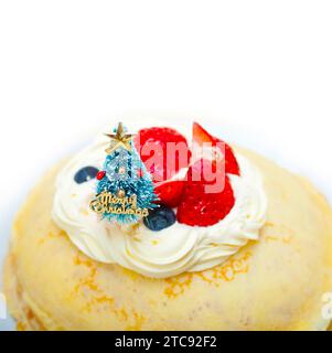 christmas tree on top of a pancake crepe mountain with whipped cream ...