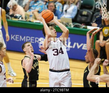 Gonzaga forward Braden Huff, center left, shoots while pressured by ...