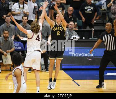 Purdue guard Fletcher Loyer (2) shoots over Indiana guard Trey Galloway ...