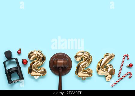 Figure 2024 with judge's gavel and Christmas decor on yellow background ...