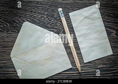 Vintage envelope clean paper sheets pencil on black board Stock Photo ...